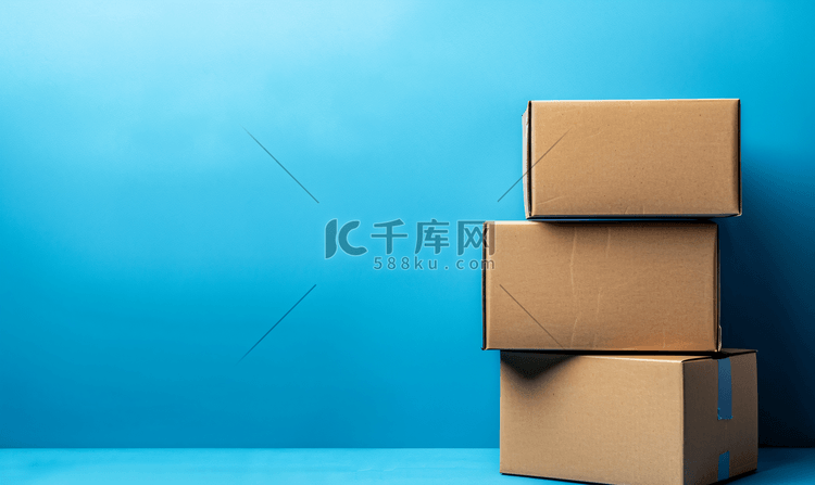 蓝色背景自由空间隔离上的纸板箱高清摄影大图 千库网