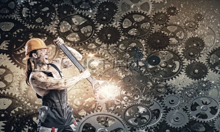 男机械师。身着带有扳手固定机构的制服的壮汉技工高清摄影大图-千库网