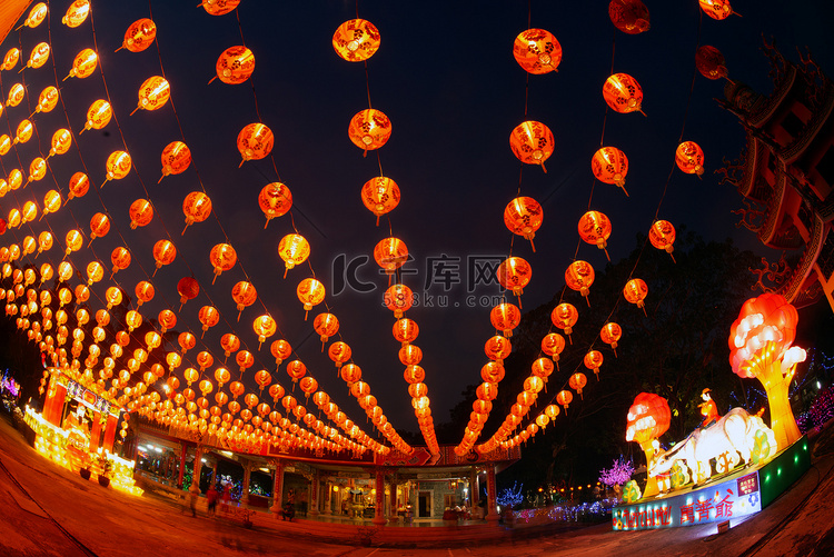 Red lanterns hanging in the black sky and god lamp at night in the ...