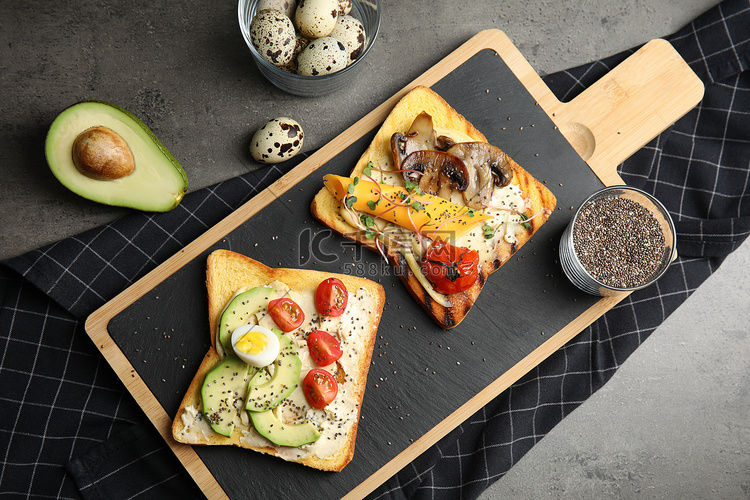 Different toasts with avocado, mushrooms, cherry tomatoes and chia ...
