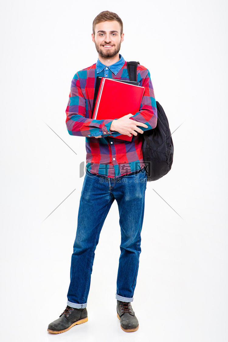 Happy male student holding books高清摄影大图-千库网