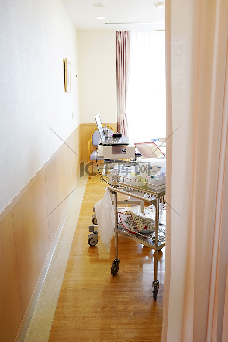 Hospital room with medical curtain and emergency equipment in a ...