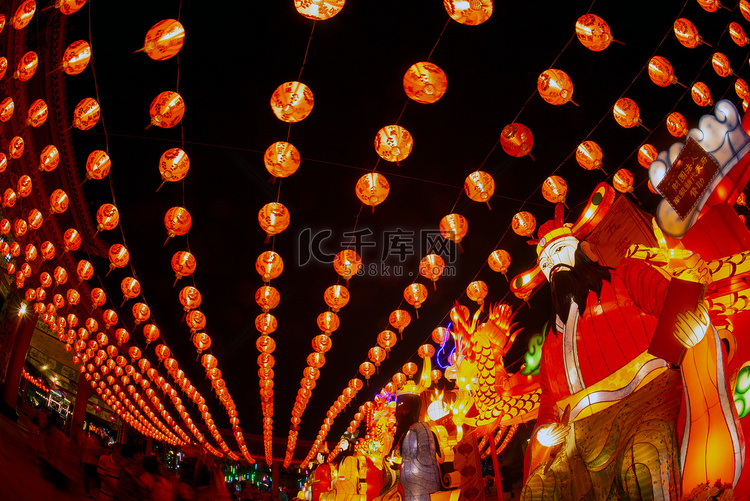 Red lanterns hanging in the black sky and god lamp at night in the ...