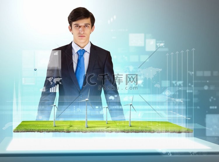 环境问题和高科技创新。年轻商人的形象看风车的高科技图片高清摄影大图-千库网