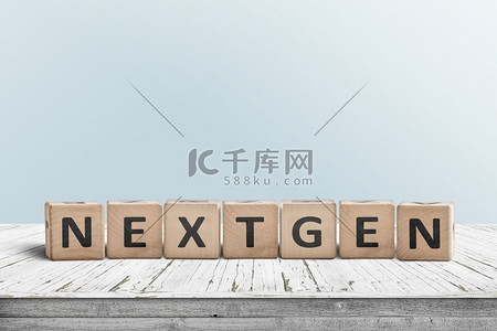 NextGen标志在一个木板桌子与青色的墙壁在背景高清摄影大图-千库网