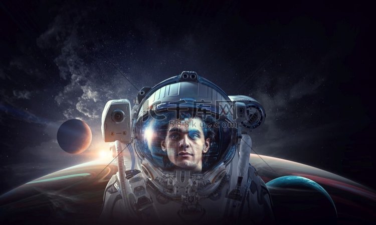 太空中的宇航员在地球行星上空。黑色桌面光绘高清摄影大图-千库网