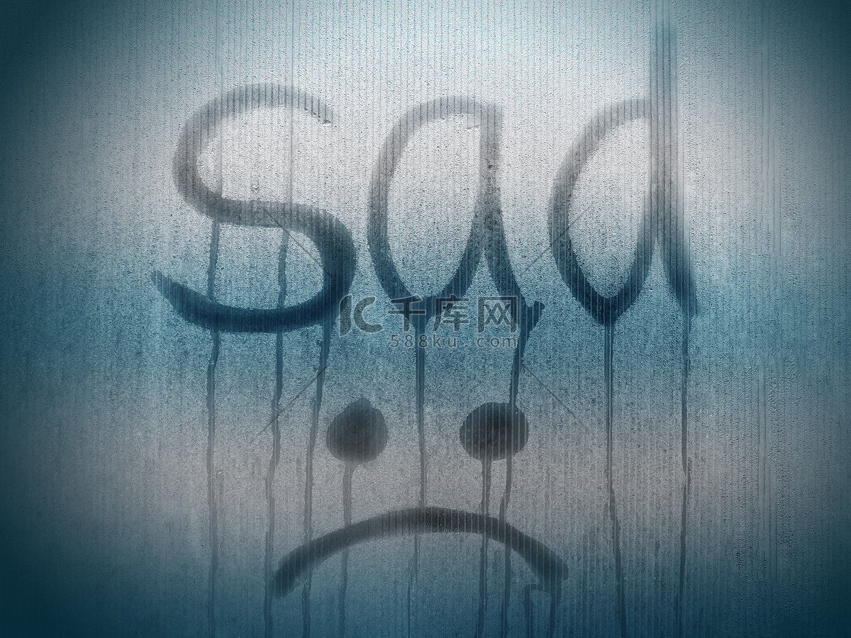 由 sad 和 Emoji 写在蓝色雾状玻璃上。高清摄影大图-千库网
