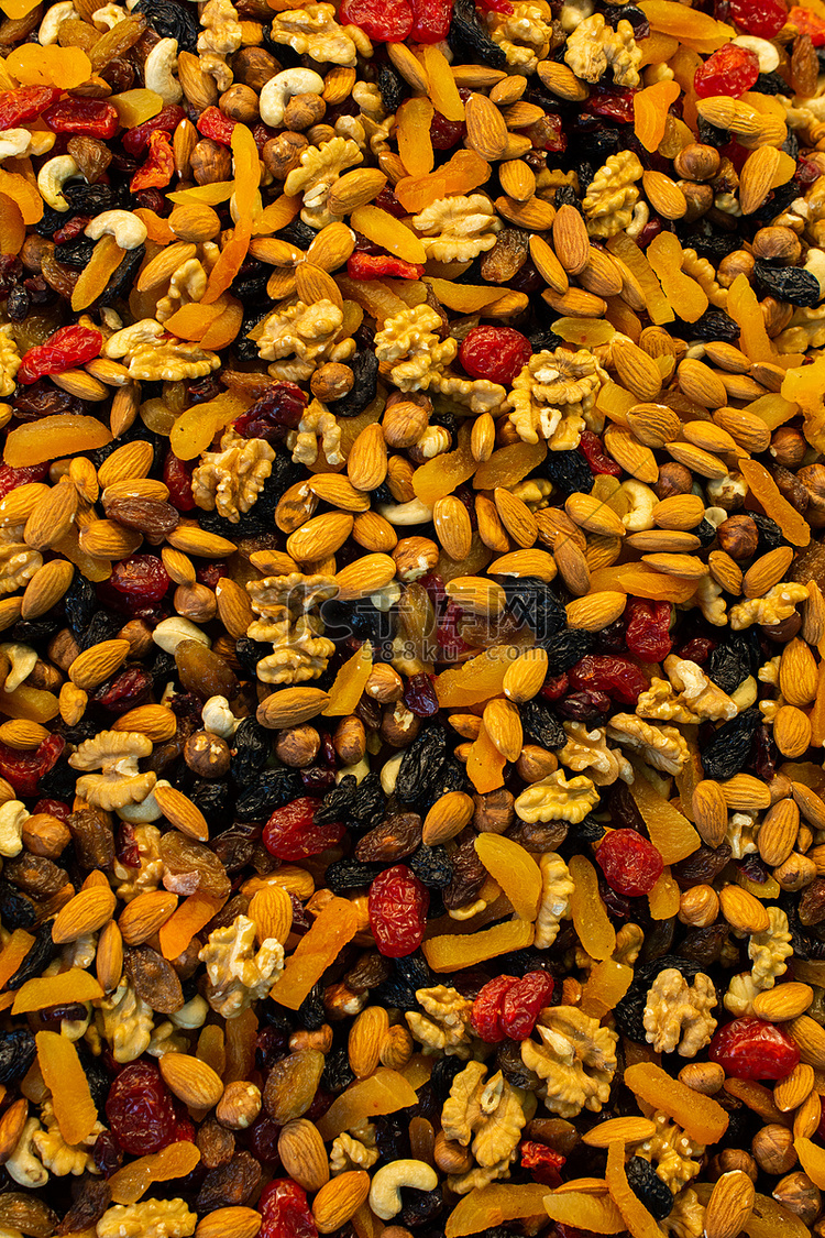 陈列着一堆什锦坚果和种子高清摄影大图-千库网