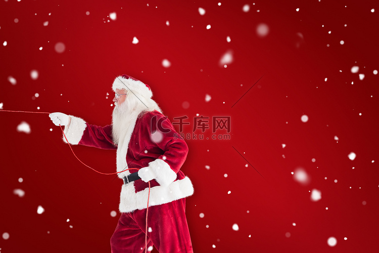 圣诞老人用绳子拉东西的合成图像高清摄影大图-千库网