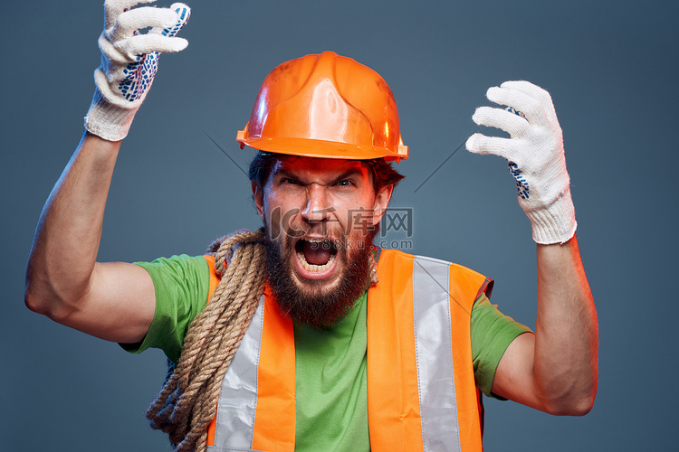 穿着工作制服安全专业蓝色背景的情感男子高清摄影大图-千库网