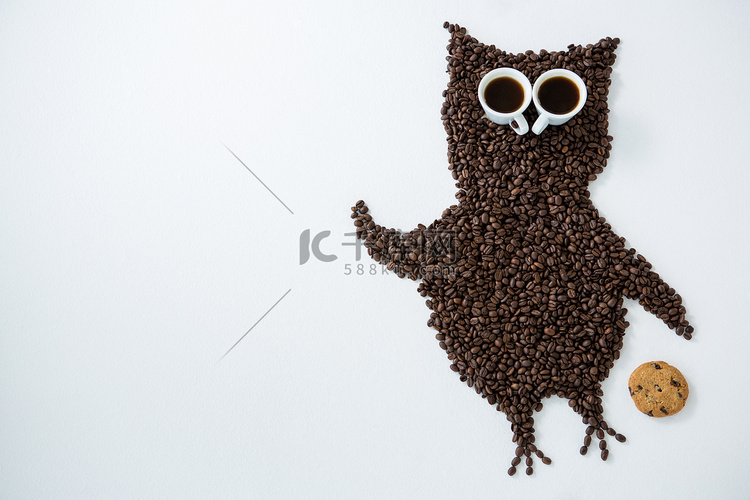 形成猫头鹰形状的咖啡豆高清摄影大图-千库网