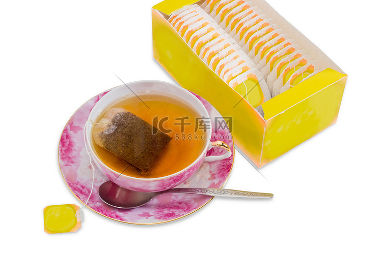 Cup of tea, spoon, saucer, box of tea bags高清摄影大图-千库网