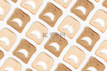 Moody emoji pattern made of slices of white and brown whole grain toast ...