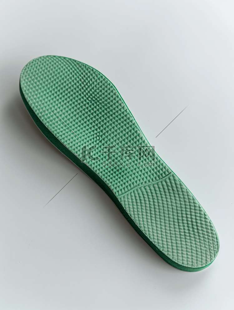 白色背景中的绿色矫形鞋垫高清摄影大图-千库网