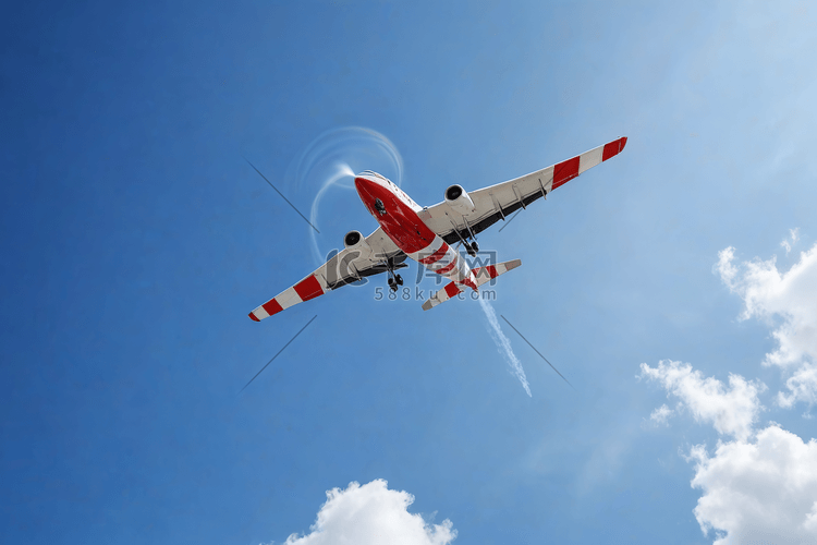 飞机在天空中飞行侧面有一条红白相间的条纹高清图片高清摄影大图-千库网
